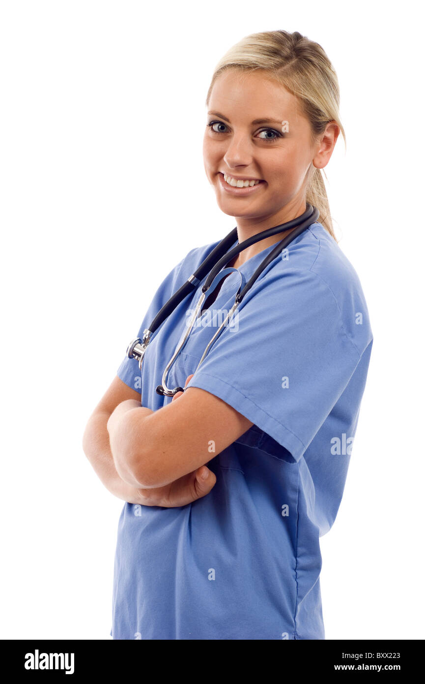 Friendly confident nurse posing and smiling in front the camera ...