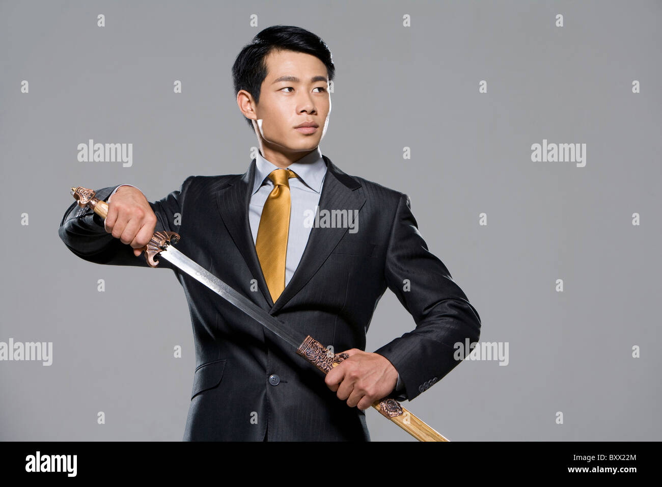 Man holding a sword hi-res stock photography and images - Alamy