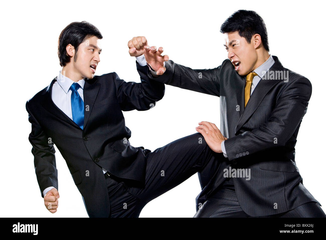 Two businessmen fighting on white background Stock Photo - Alamy