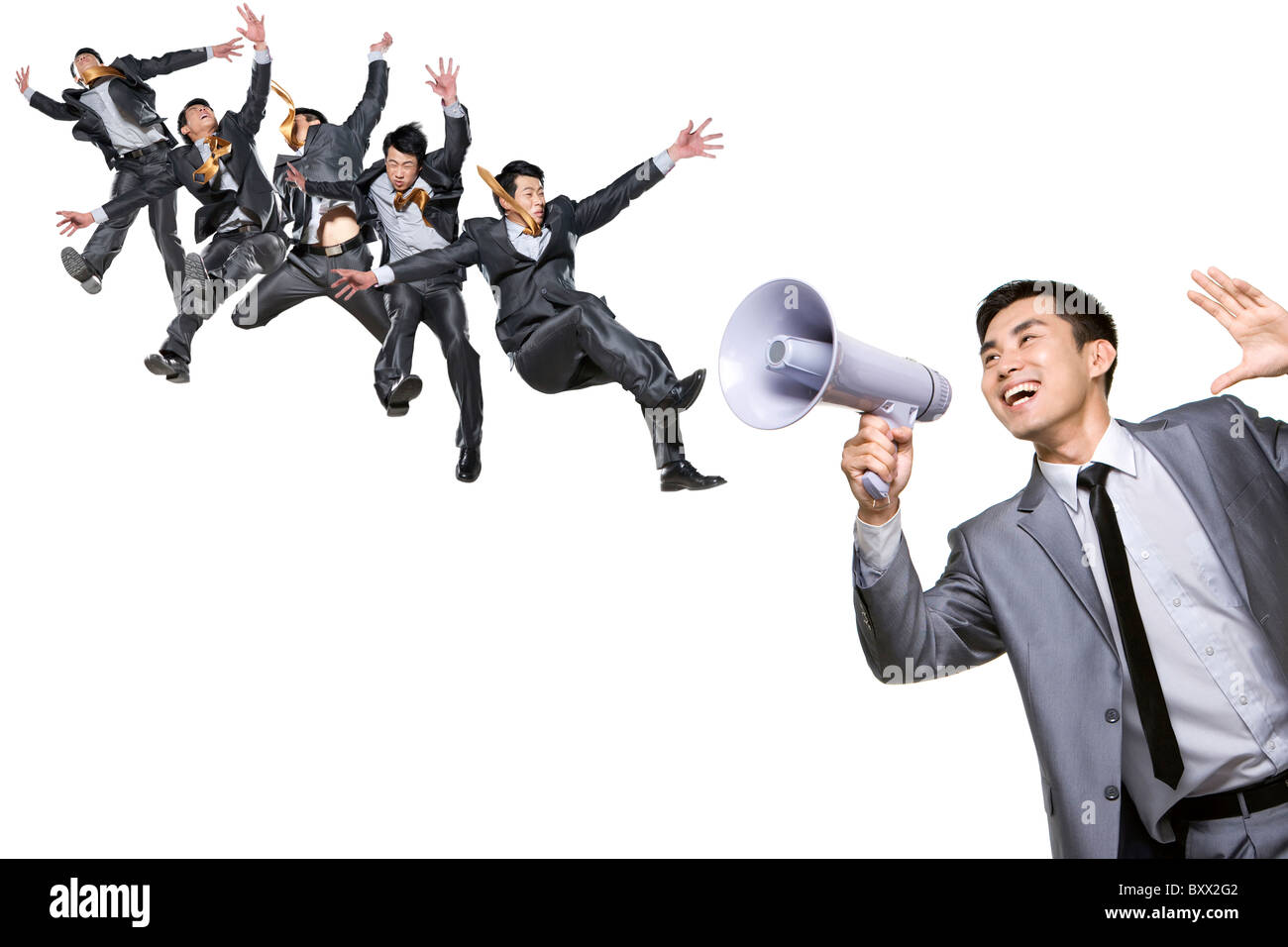 Blowing people away with megaphone Stock Photo - Alamy