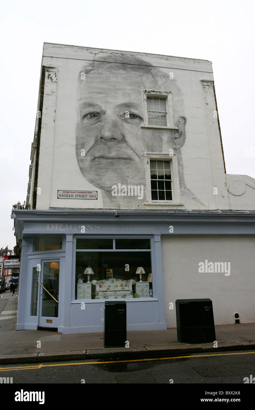 A painting of a man's face on the side of a building in Chelsea, London ...