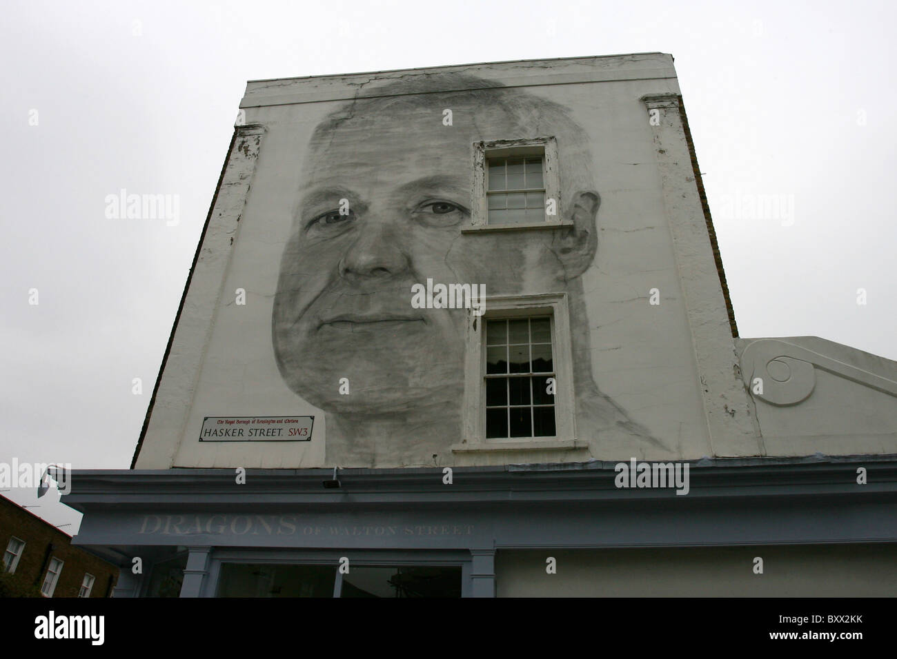 A painting of a man's face on the side of a building in Chelsea, London ...