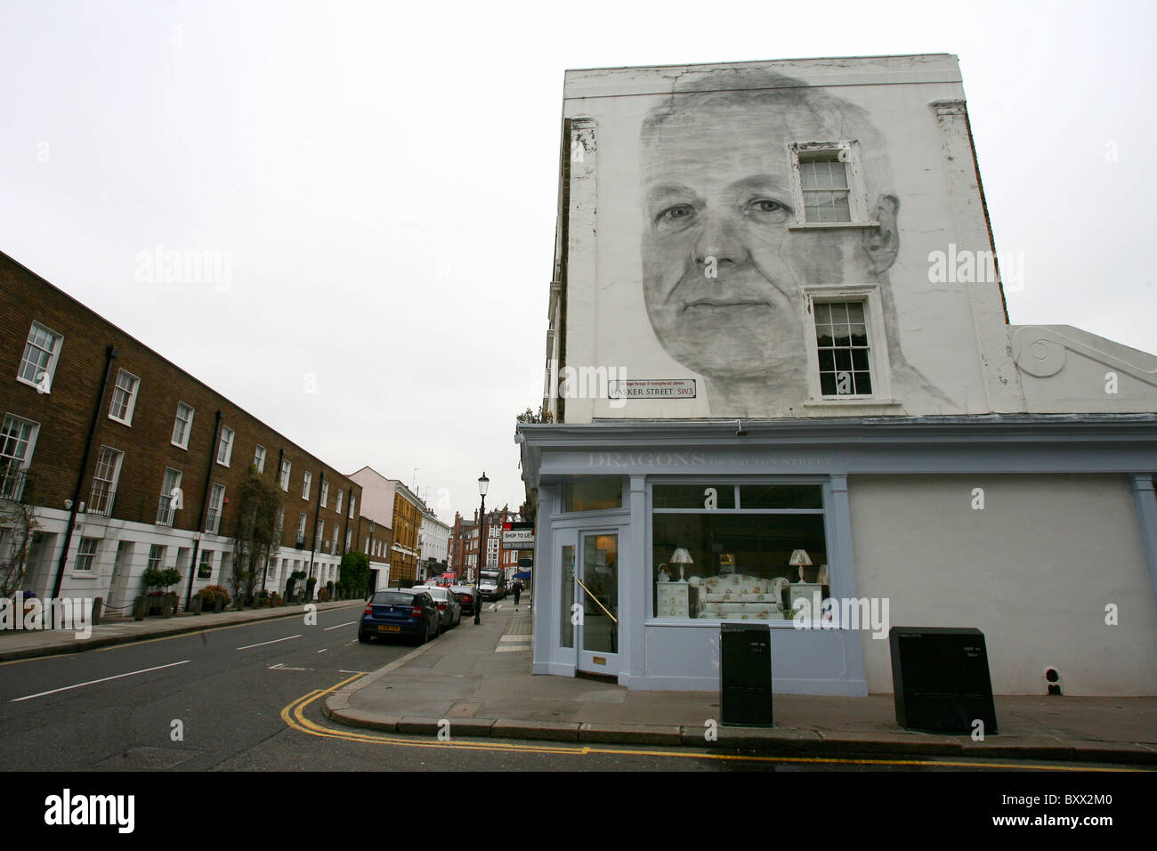 A painting of a man's face on the side of a building in Chelsea, London ...