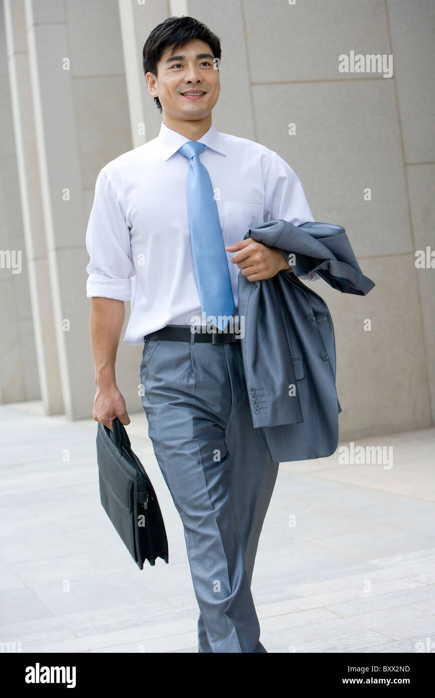 Businessman on the move Stock Photo - Alamy