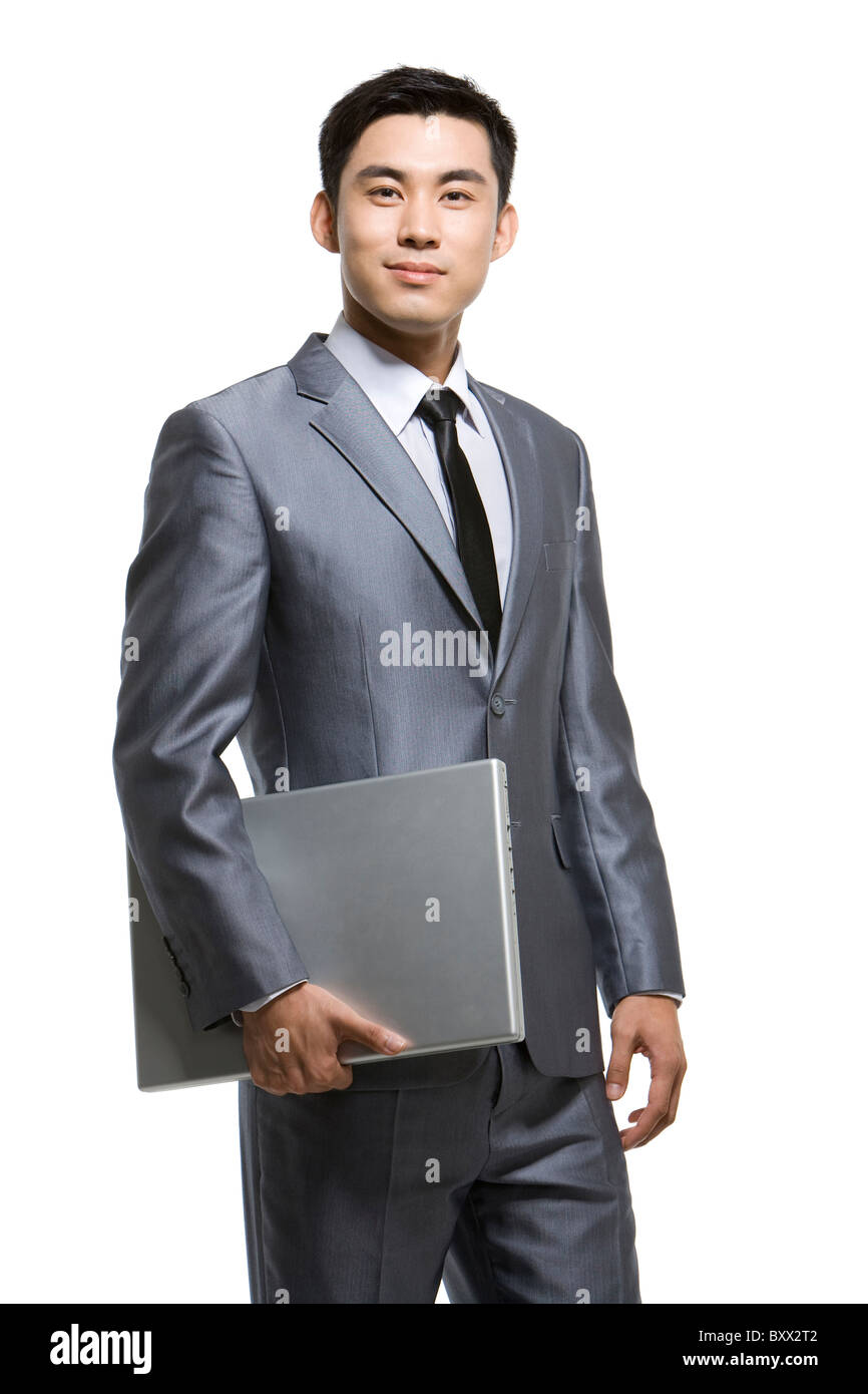 Businessman holding laptop Stock Photo - Alamy