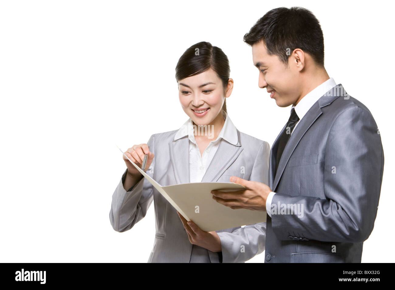 Businessmen looking through papers Stock Photo - Alamy