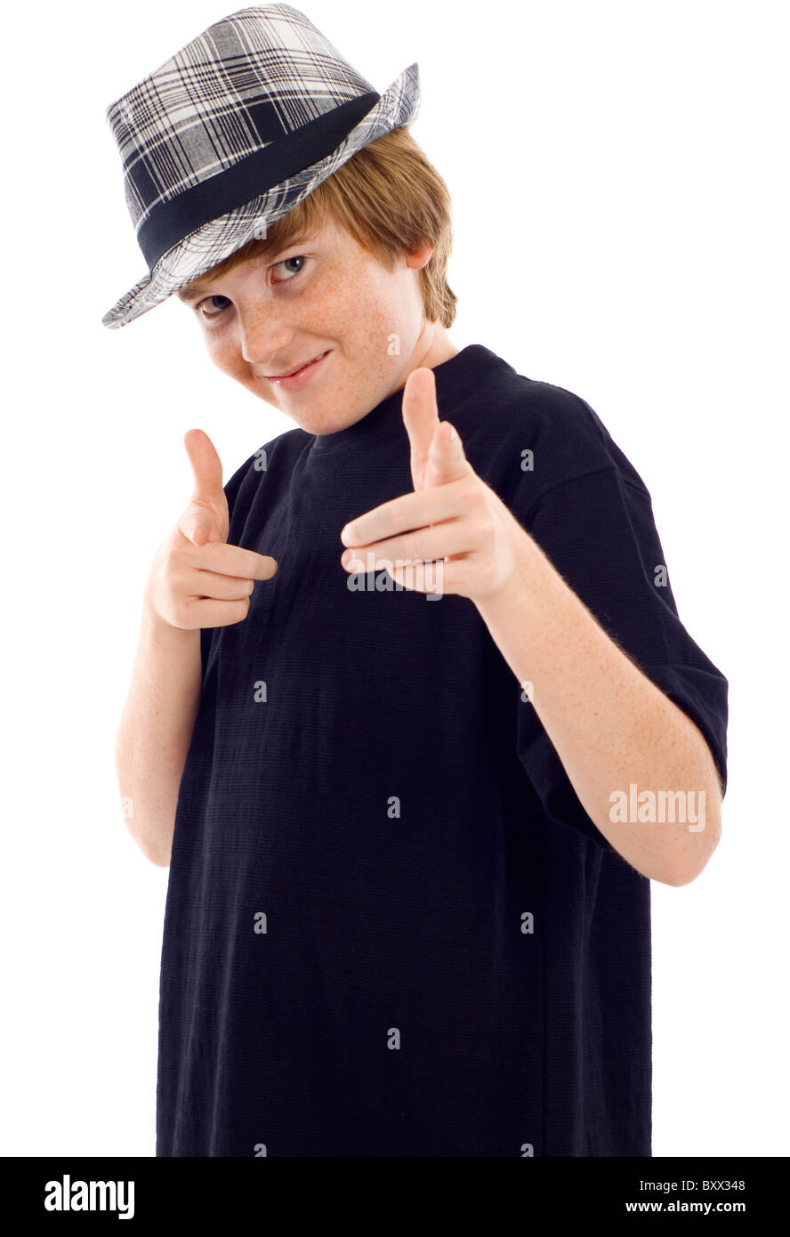 Smiling confident young boy pointing at the camera isolated over white ...