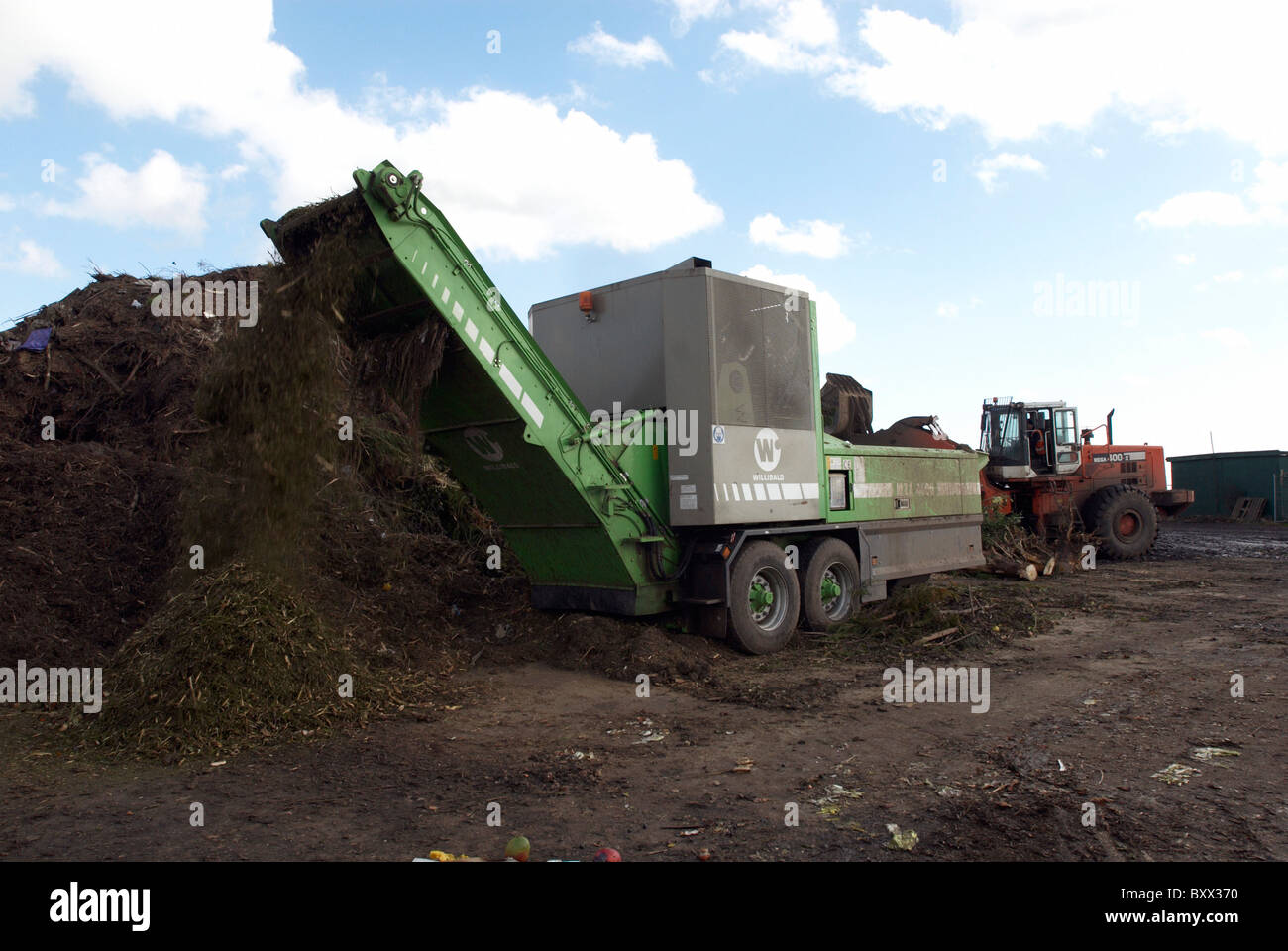 Composter producing compost at site for recycling food and garden waste ...
