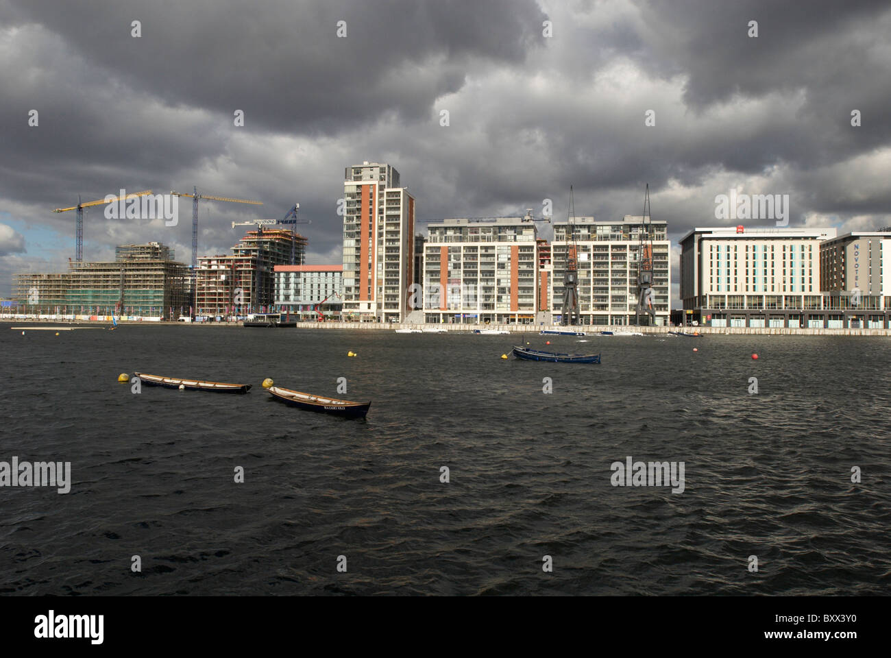 Thames River in front of construction work at the Royal Victoria Dock ...