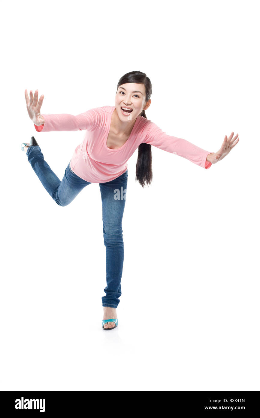 Woman Standing On One Leg Stock Photo - Alamy