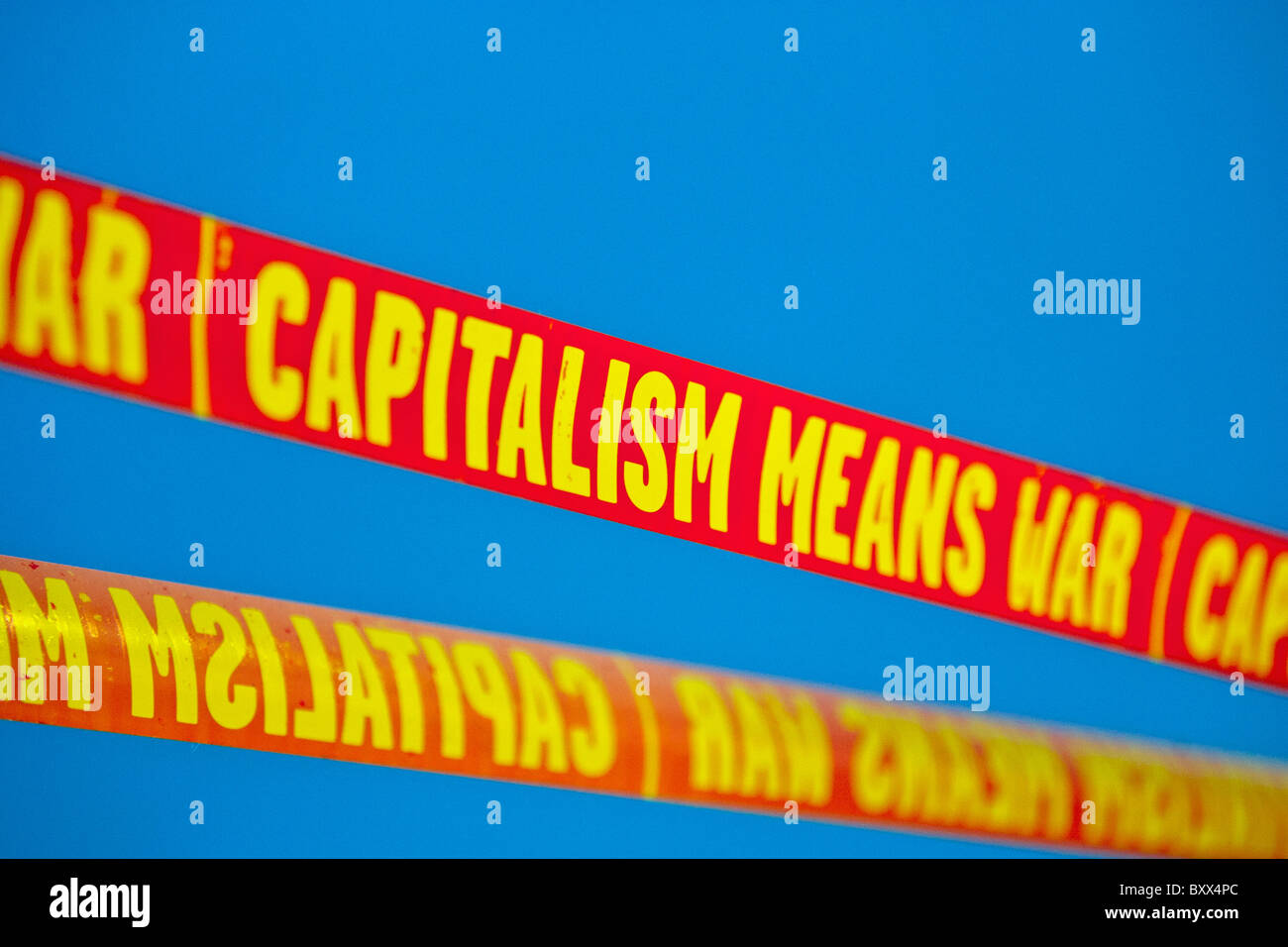Tape bearing anti-capitalist slogans are photographed in Parliament ...