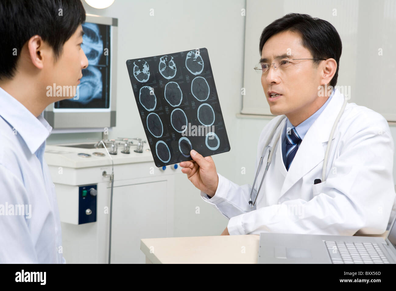 Doctor speaking with his patient Stock Photo - Alamy