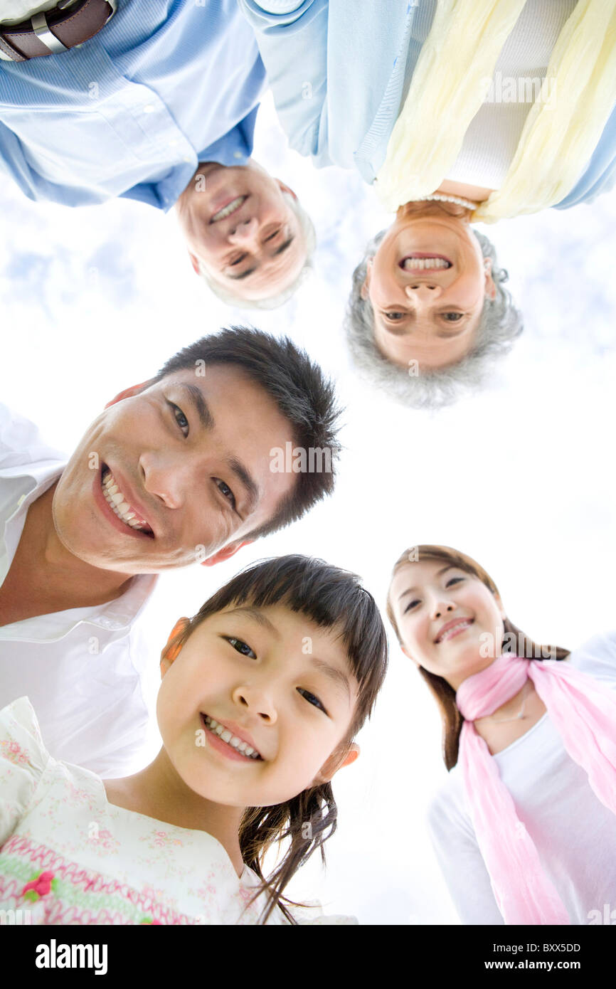 A shot of the whole family from a low angle Stock Photo - Alamy
