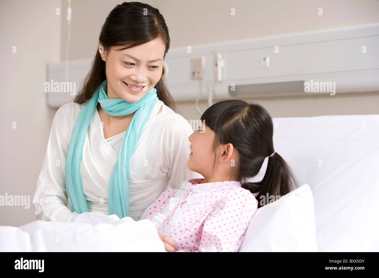 Portrait of a young patient with her mother Stock Photo - Alamy