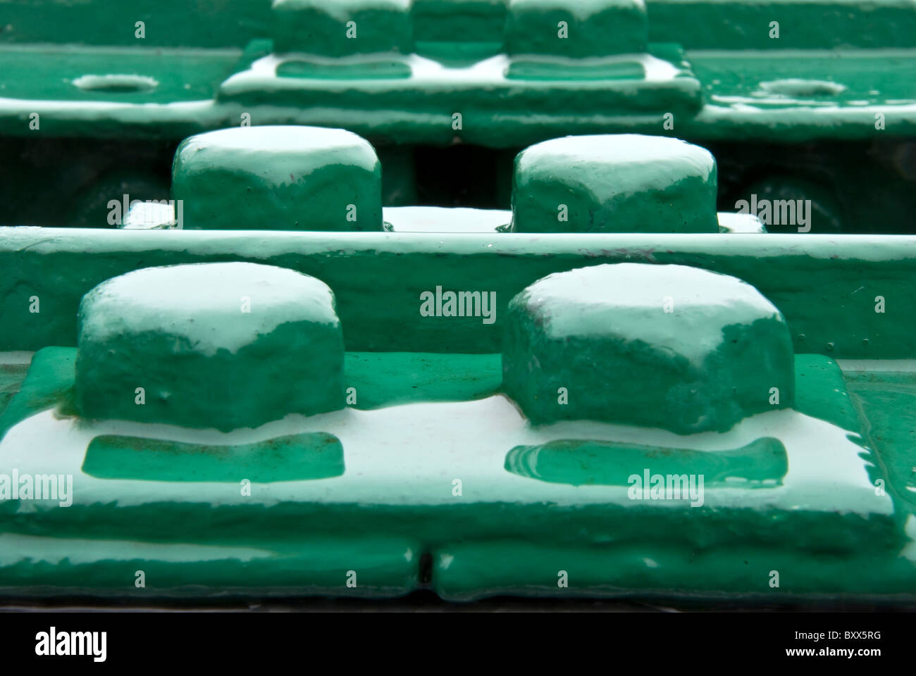 Green painted bolts on a girder Stock Photo - Alamy