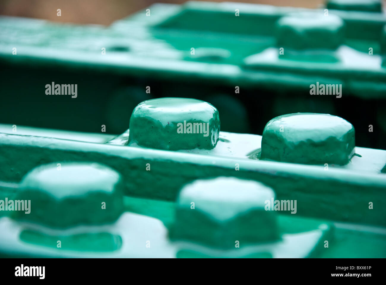 Green painted bolts on a girder Stock Photo - Alamy
