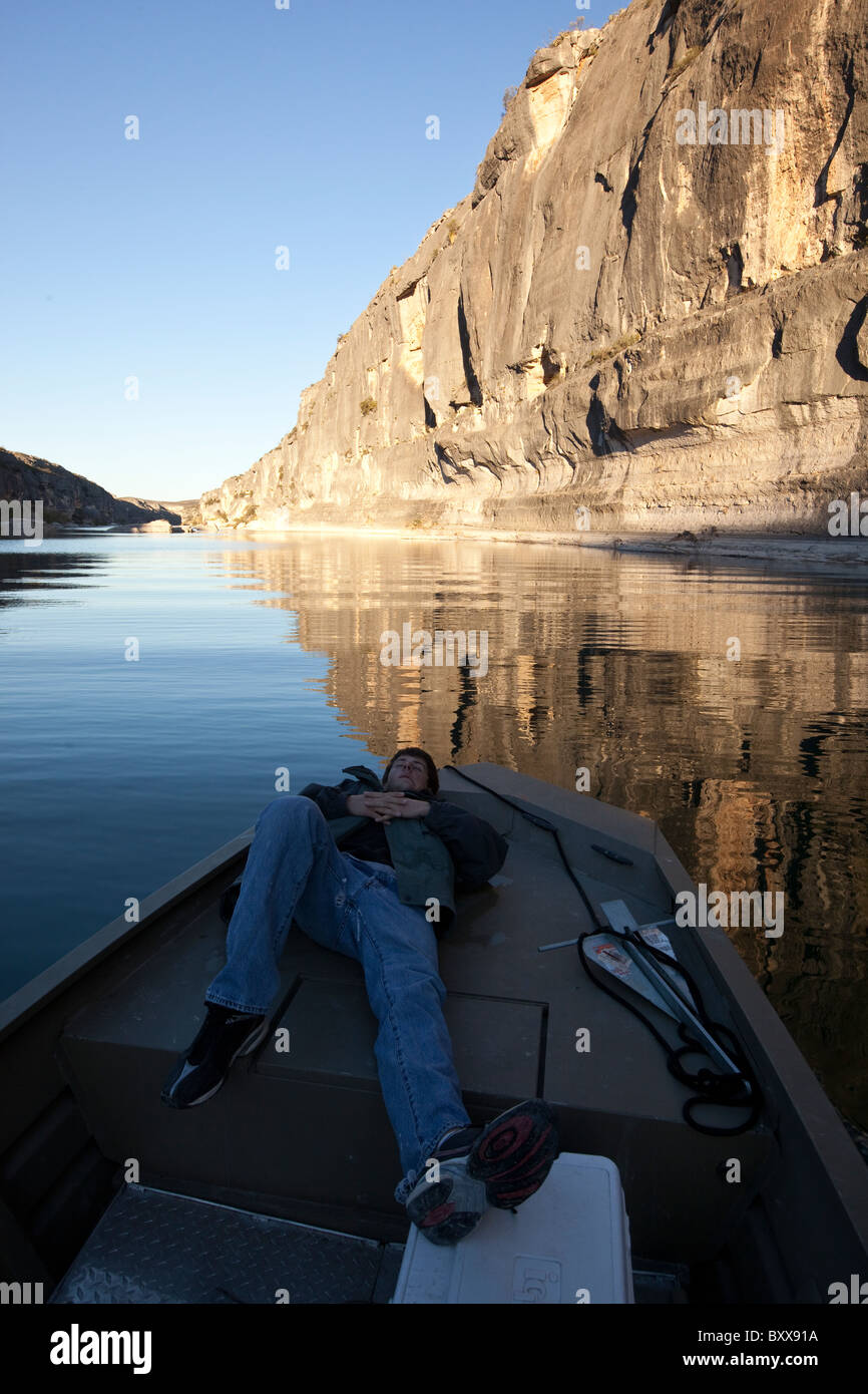Dolomitic limestone cliffs reflected in the waters of the Pecos River ...