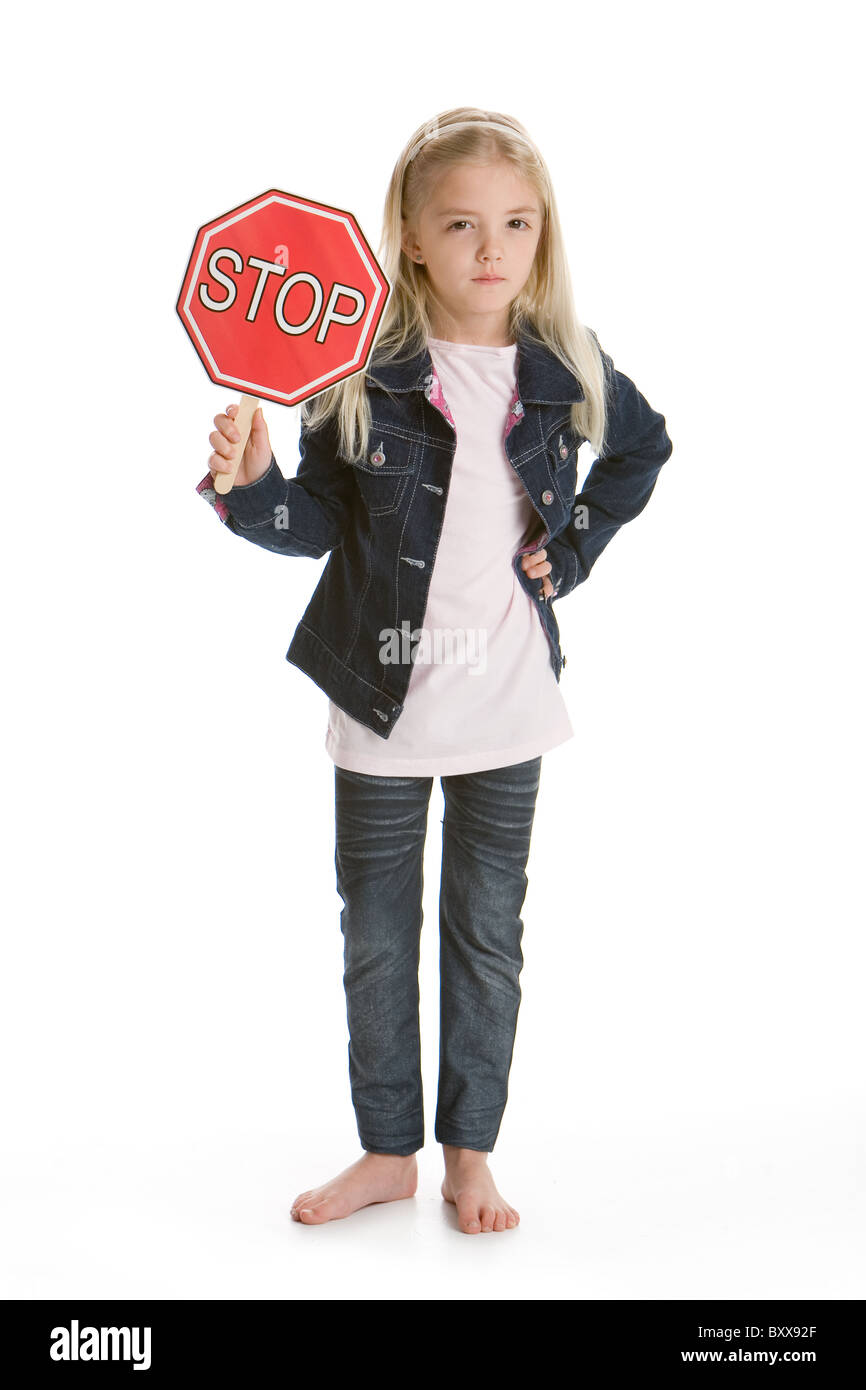 Cute little girl standing and holding a stop sign Stock Photo - Alamy