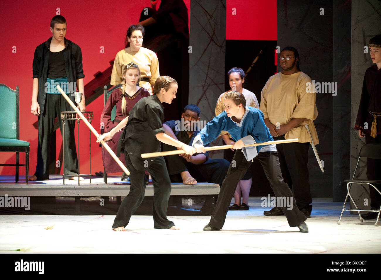 Students on stage during their school production of Shakespeare's ...