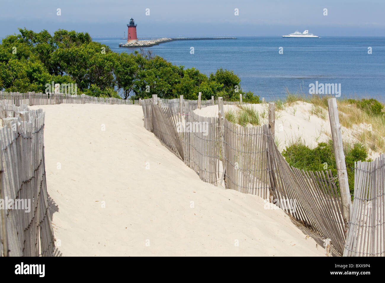 Beach walk sand, seascape, beach fence, lighthouse and boat, Delaware ...