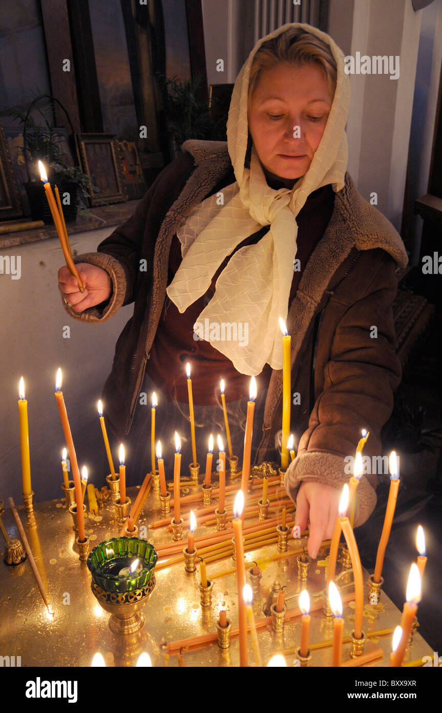 Woman church candles hi-res stock photography and images - Alamy