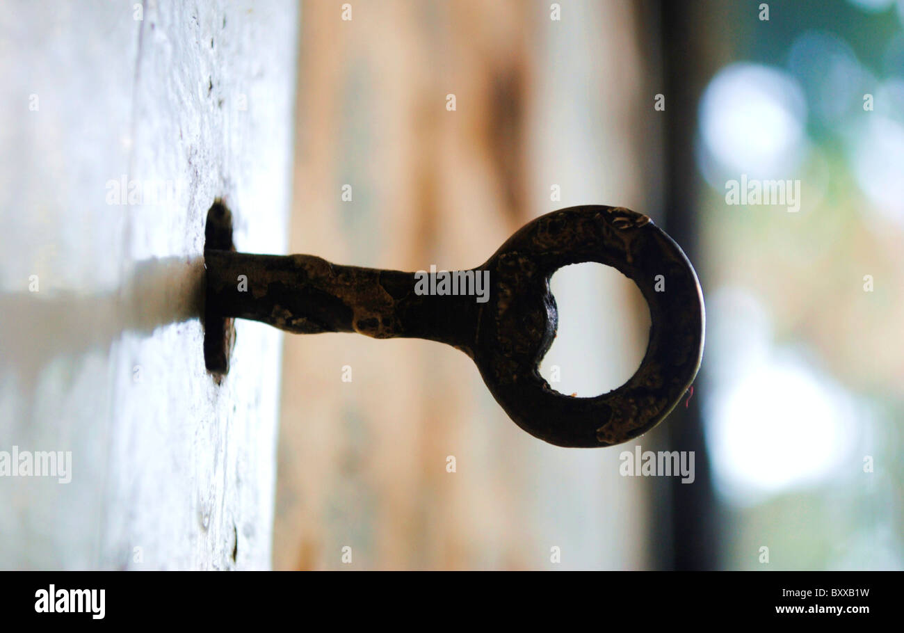 Rusty key in lock Stock Photo - Alamy