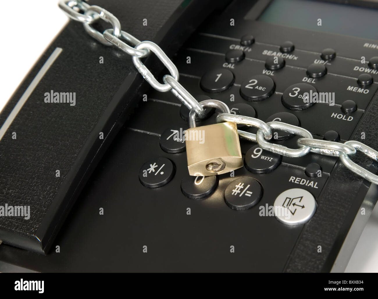 Black telephone is secured with metal chain and lock Stock Photo - Alamy