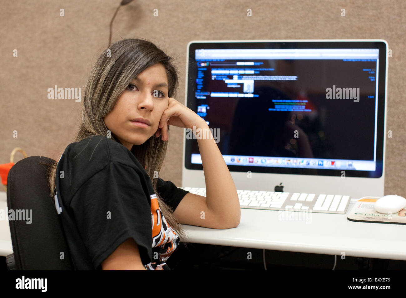 Hispanic female student does classwork in computer lab at McCamey High ...