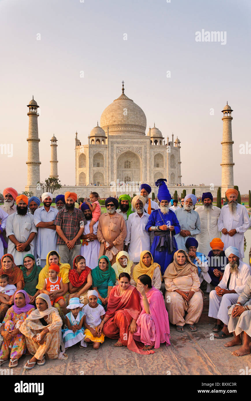 Large family group of sikhs posing in front of The Taj Mahal, a ...