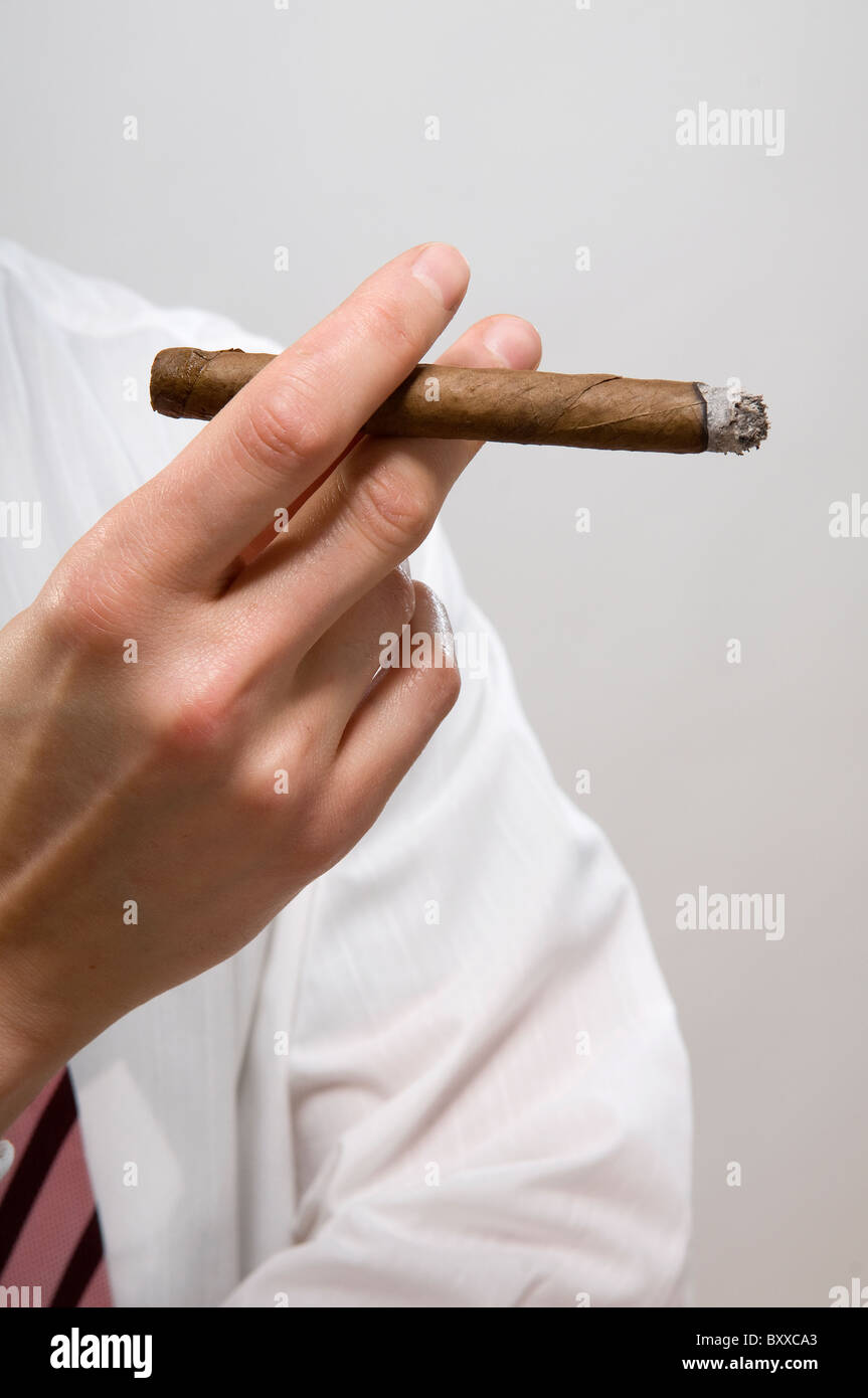 Hand holding a cigar Stock Photo - Alamy