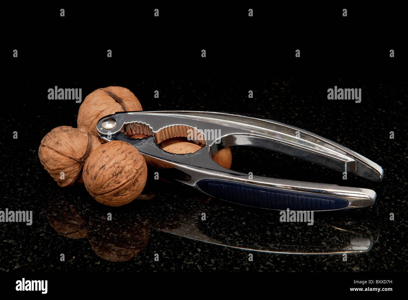 Metal nut cracker with walnuts hi-res stock photography and images - Alamy