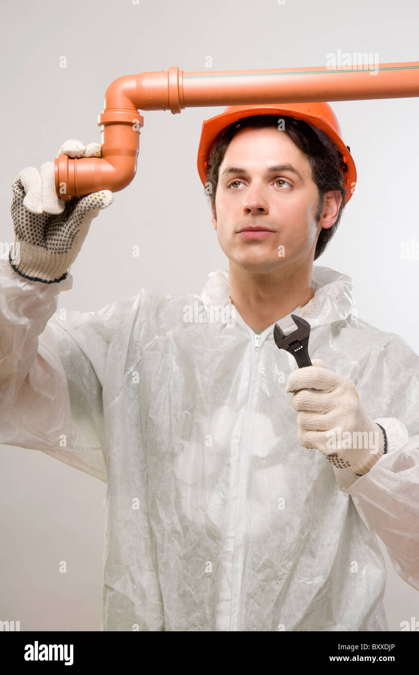 plumber using wrench on pipe Stock Photo - Alamy