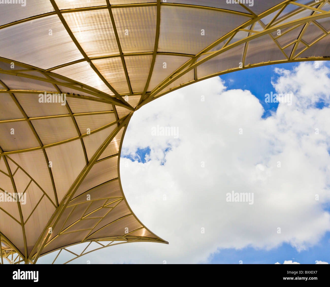 Translucent Roof opening to blue sky with clouds Stock Photo - Alamy