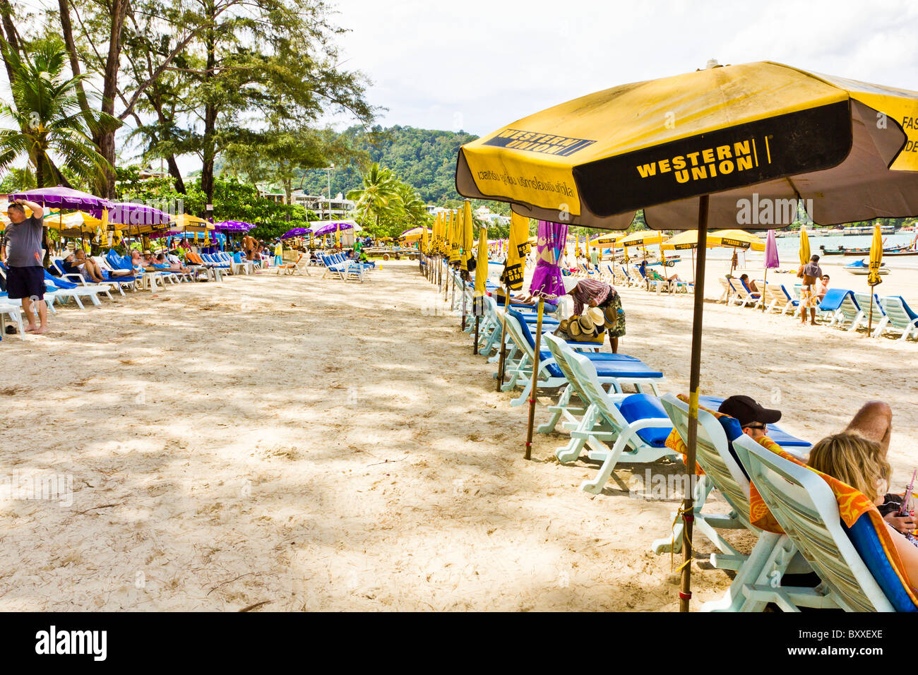 Padong beach with tourists relaxing in beach chairs Stock Photo - Alamy