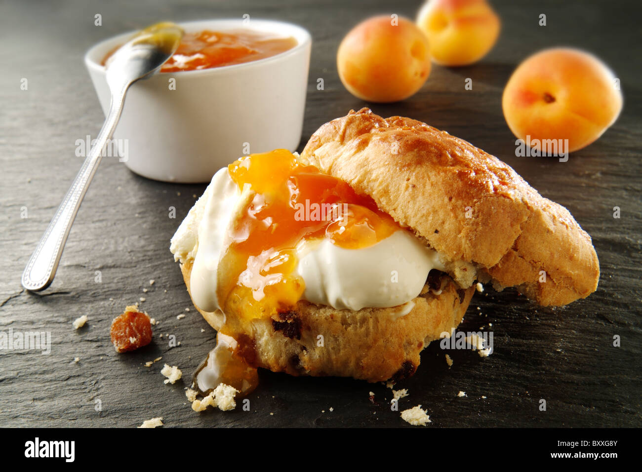 Traditional British scones with clotted cream and apricot jam Stock ...