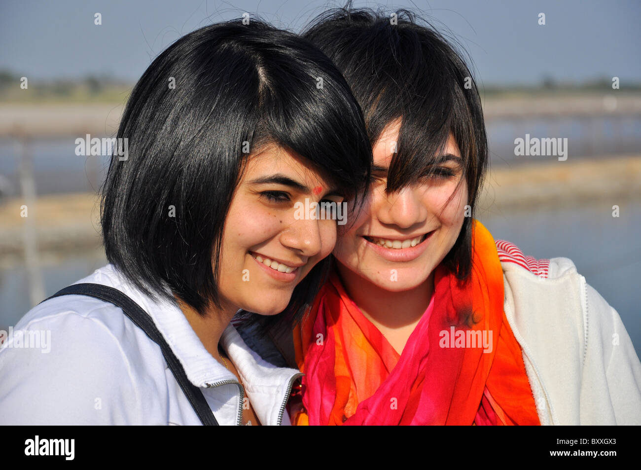 Two Indian girls smiling Stock Photo - Alamy