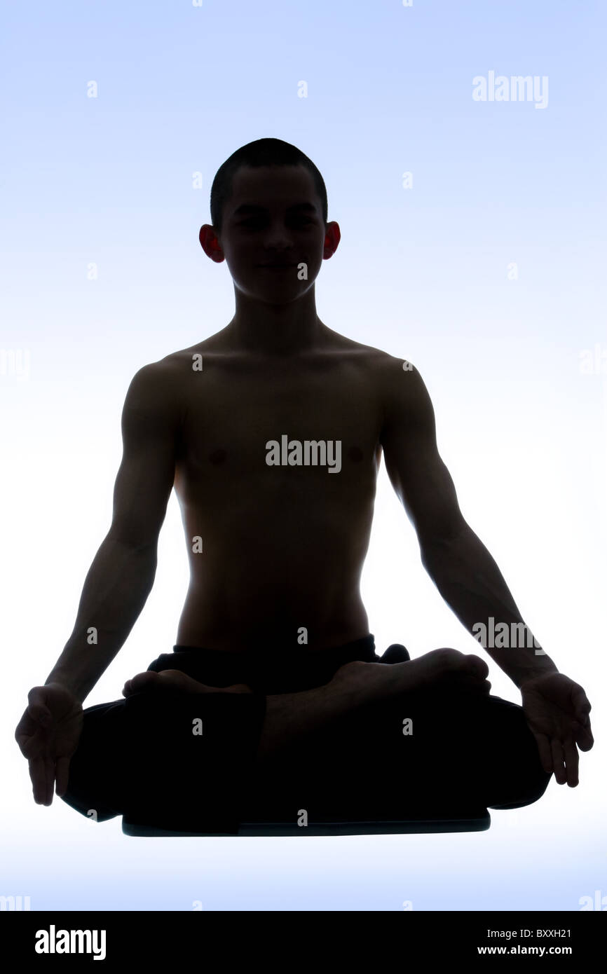 Photo of young man doing meditation in pose of lotus Stock Photo - Alamy