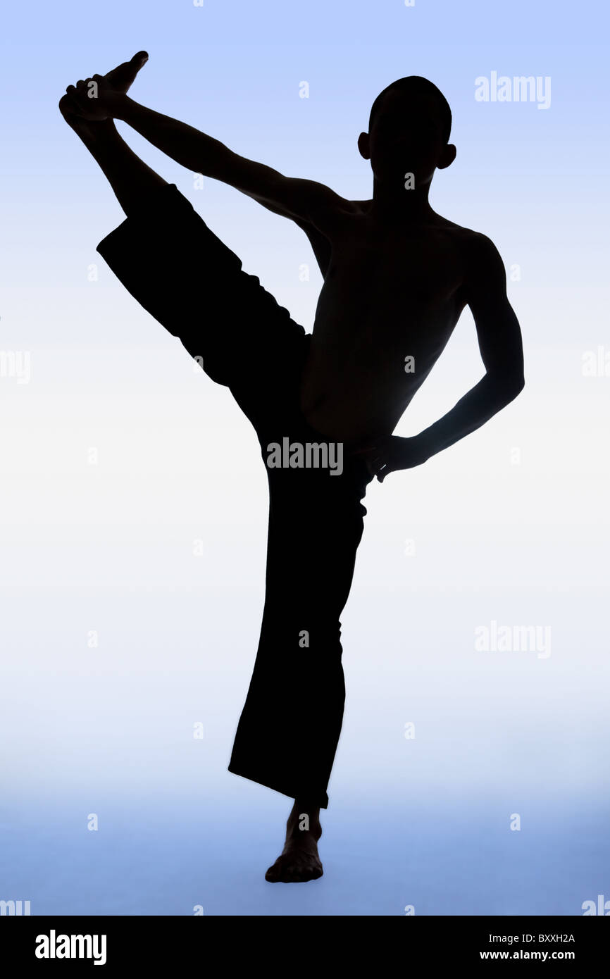 Portrait of man holding the leg in his hand Stock Photo - Alamy