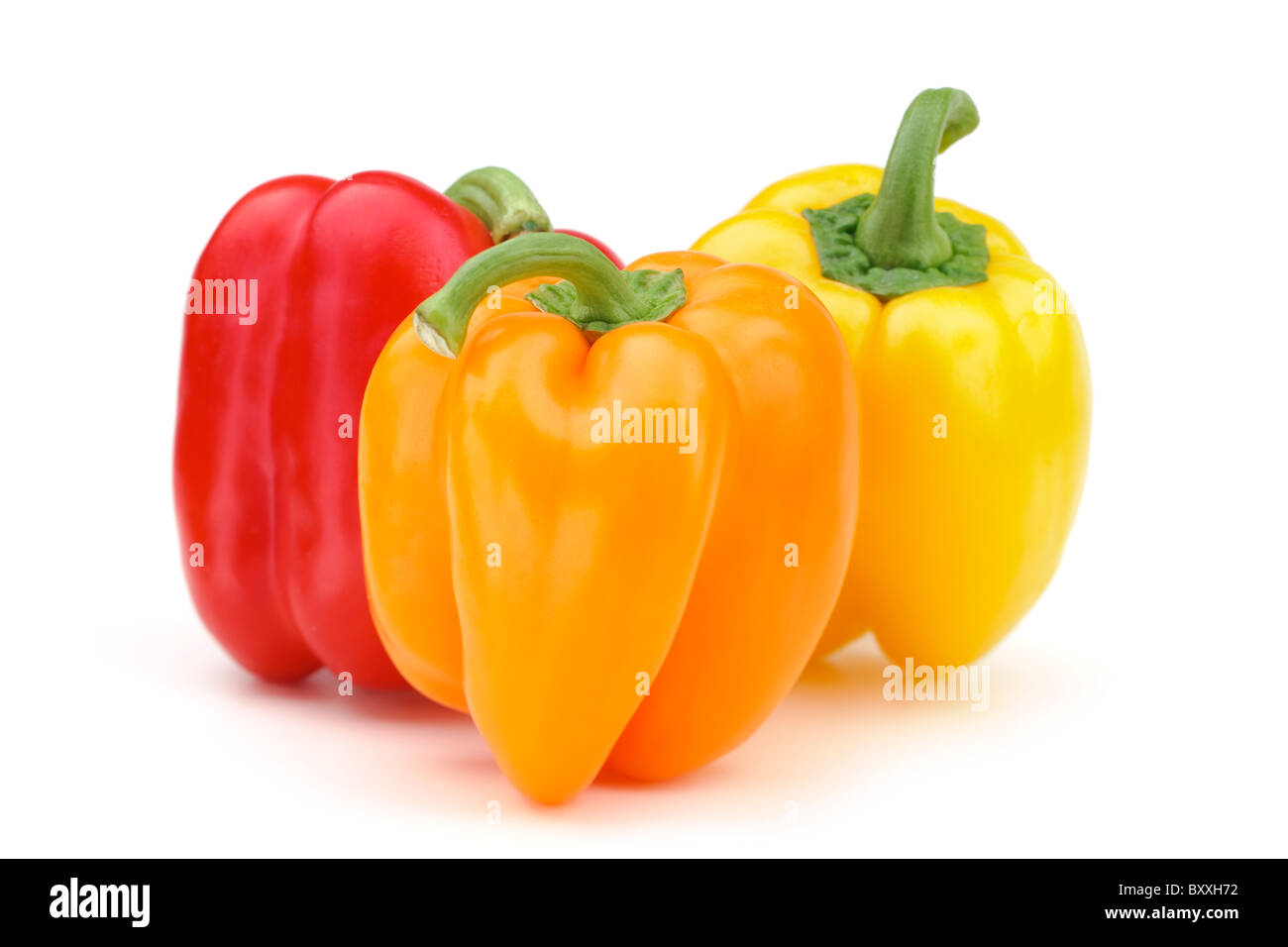 Red Yellow and orange capsicum peppers Stock Photo - Alamy