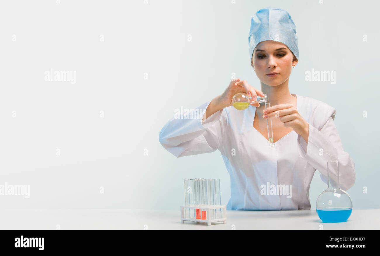 Portrait of medical professional filling flask with liquid Stock Photo ...