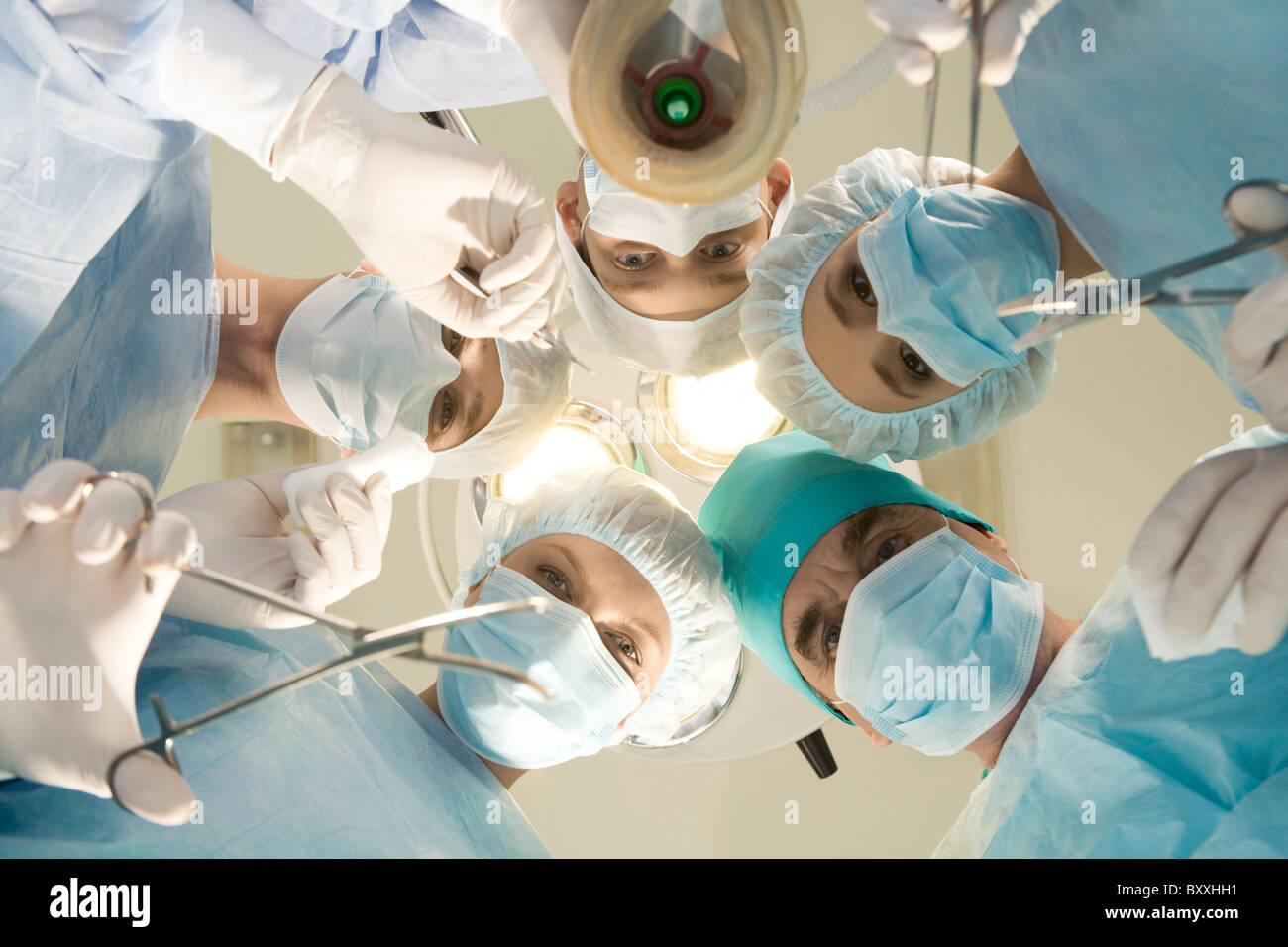 Hands surgical team working instruments hi-res stock photography and ...