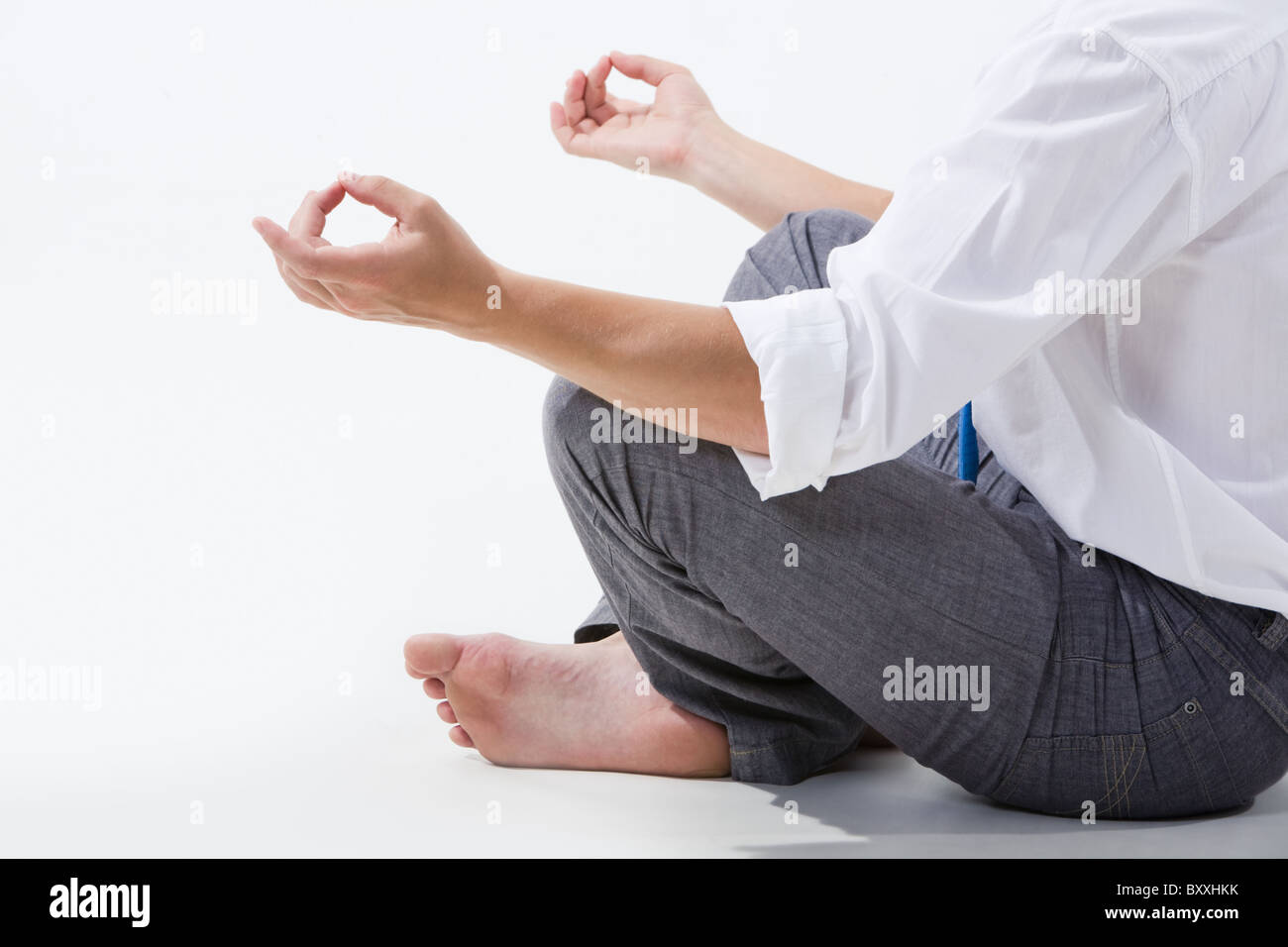 Close-up of masculine arms and crossed legs during meditation Stock ...