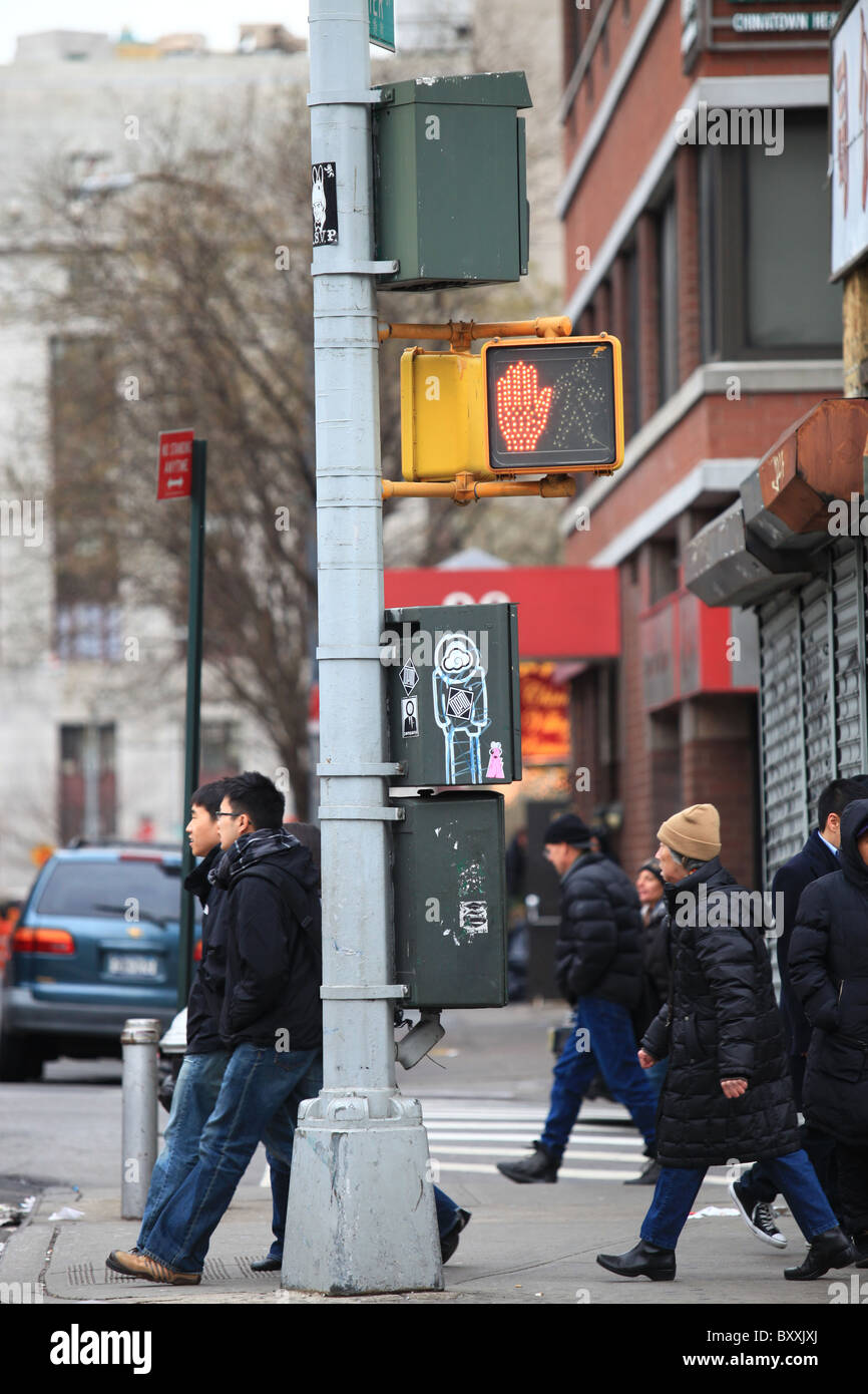 People walking through an intersection in Chinatown, New York city ...