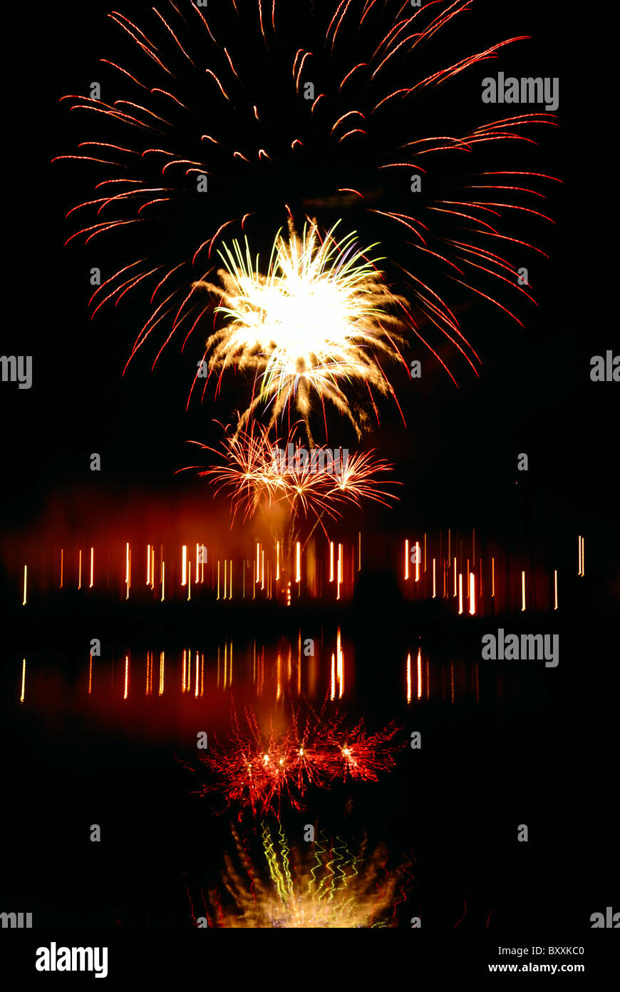 night traditional firework with reflection in water Stock Photo - Alamy
