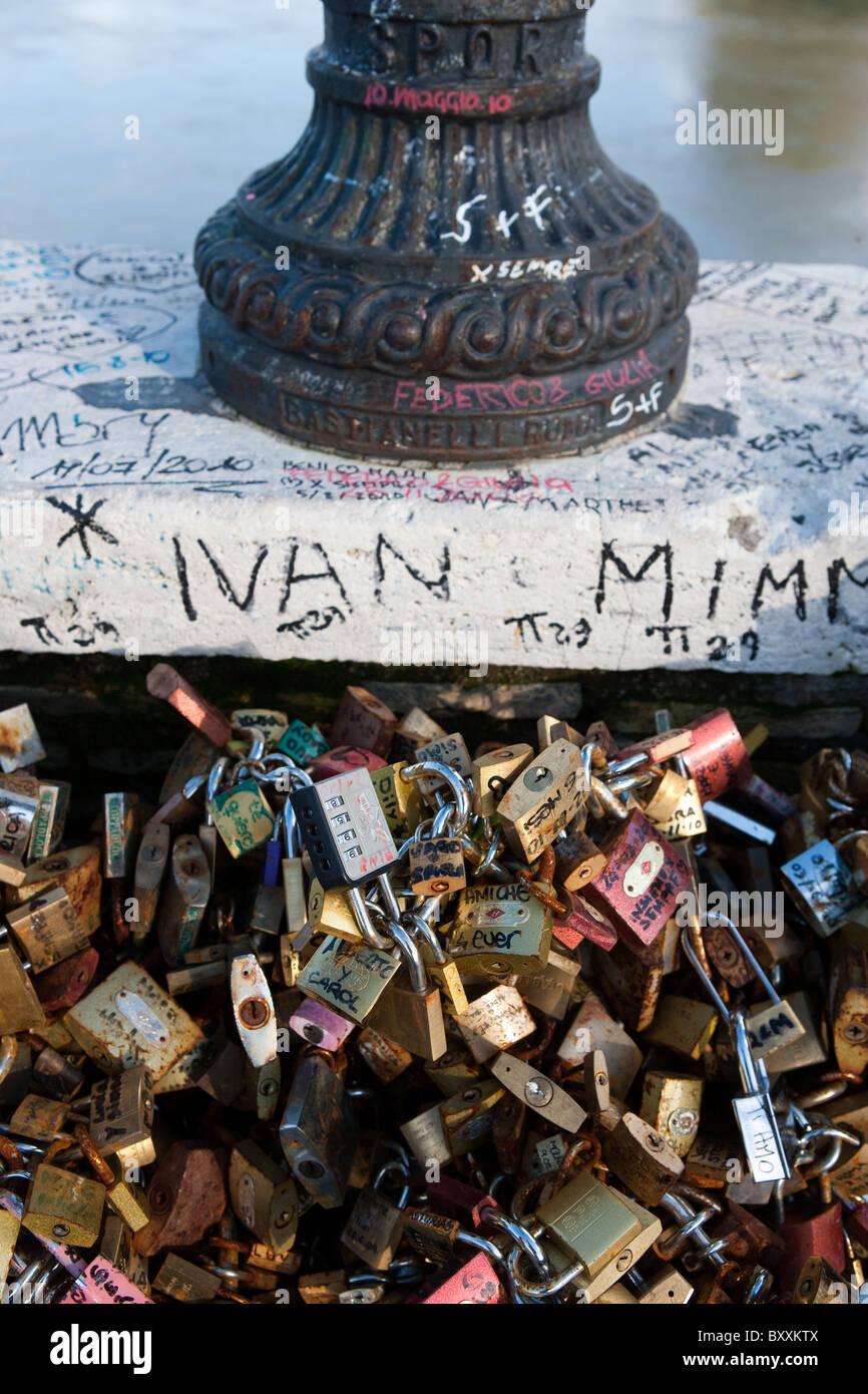 First love lock locks on the Milvio bridge chained to wall Rome Italy ...