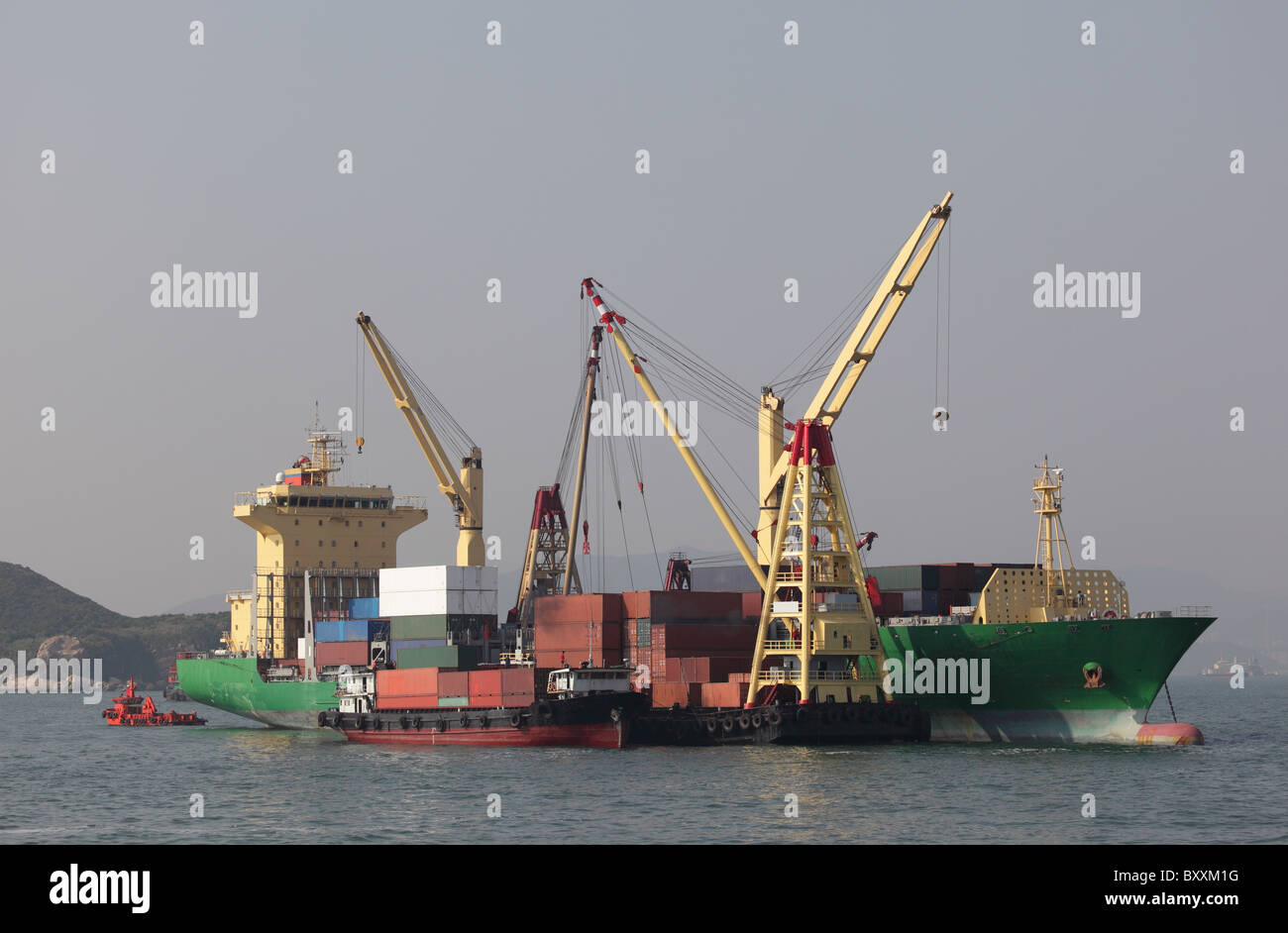 Large cargo ship unloading containers Stock Photo - Alamy