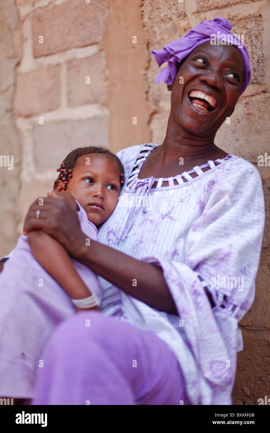Mossi woman and child at a baptism in Ouagadougou, Burkina Faso Stock ...