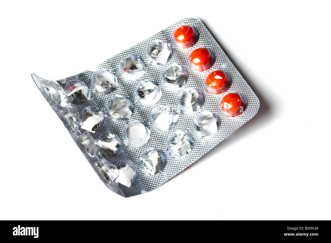 some red pills isolated on white background Stock Photo - Alamy