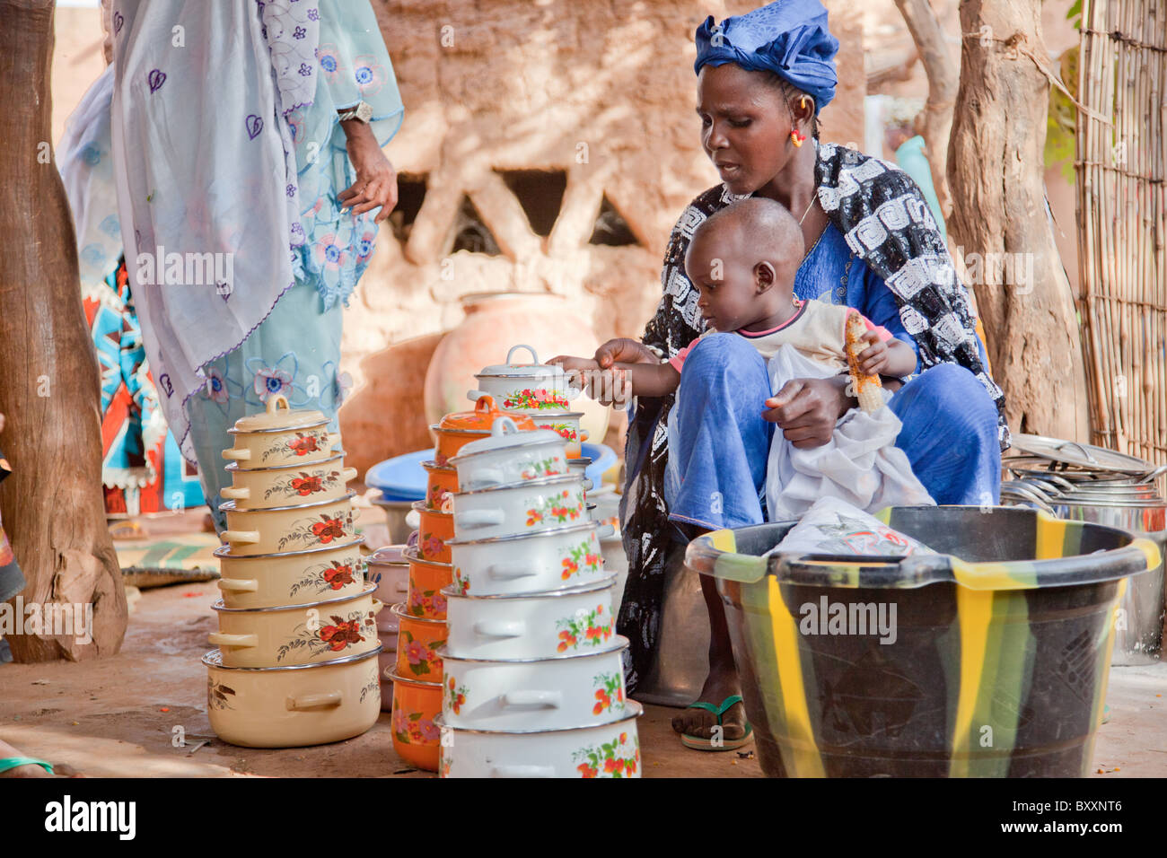 In northern Burkina Faso, a Fulani wedding has taken place. Women bring ...