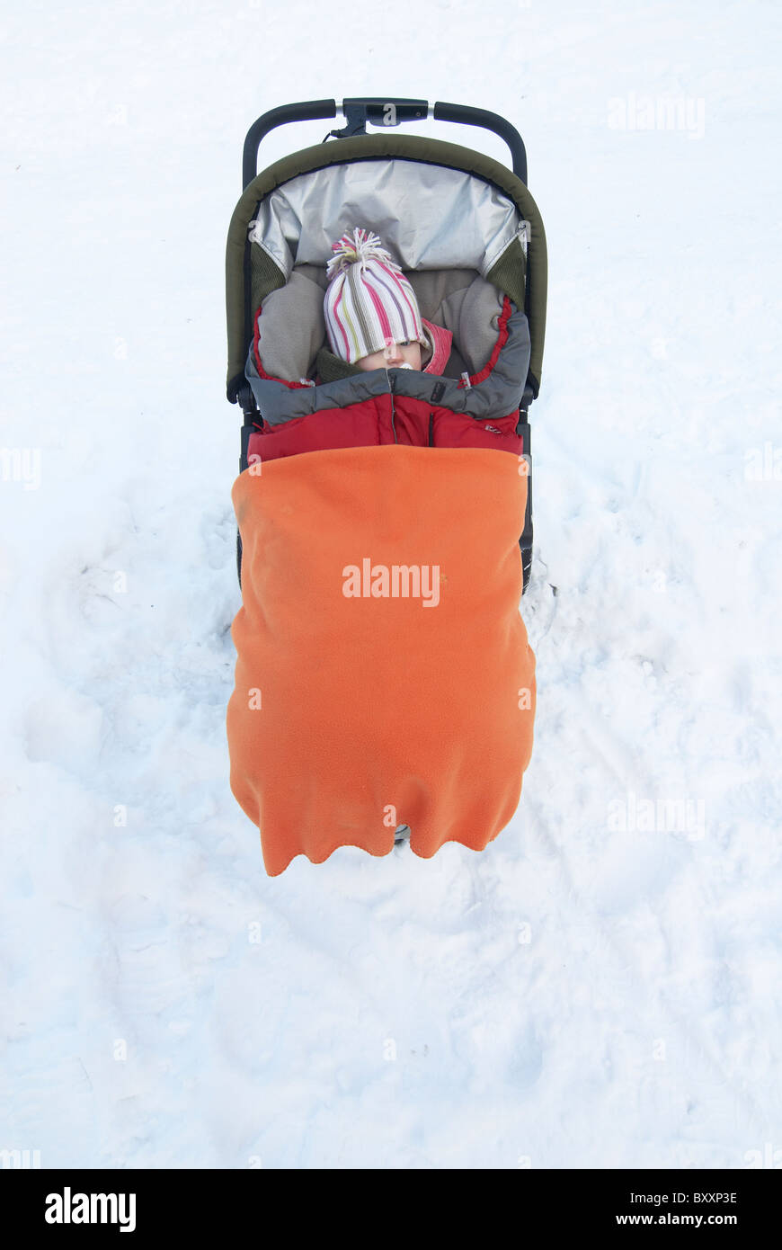Child baby girl in buggy - pram - winter outside Stock Photo - Alamy